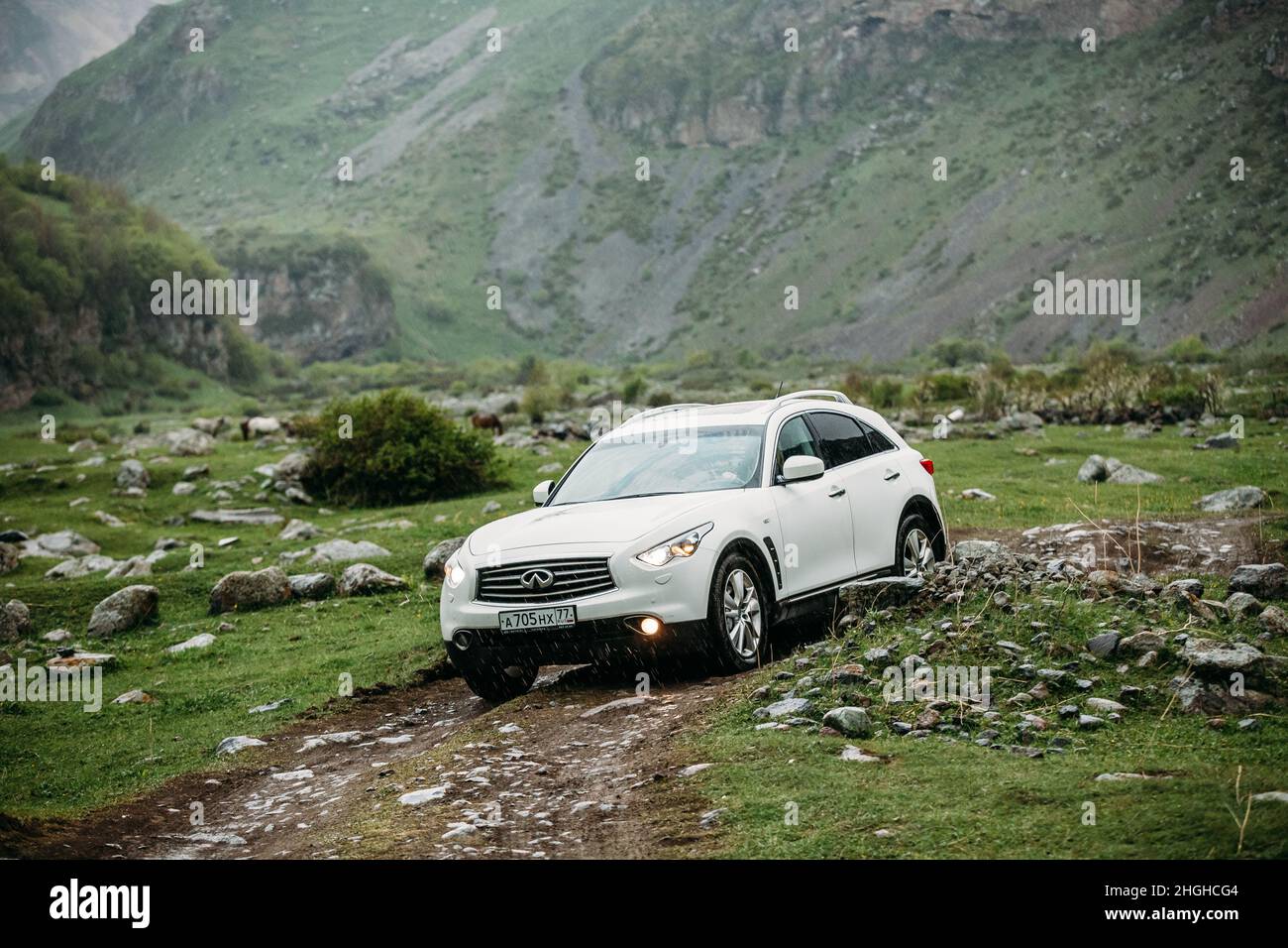White Infiniti FX30d turbo diesel SUV Car On Off Road In Spring ...