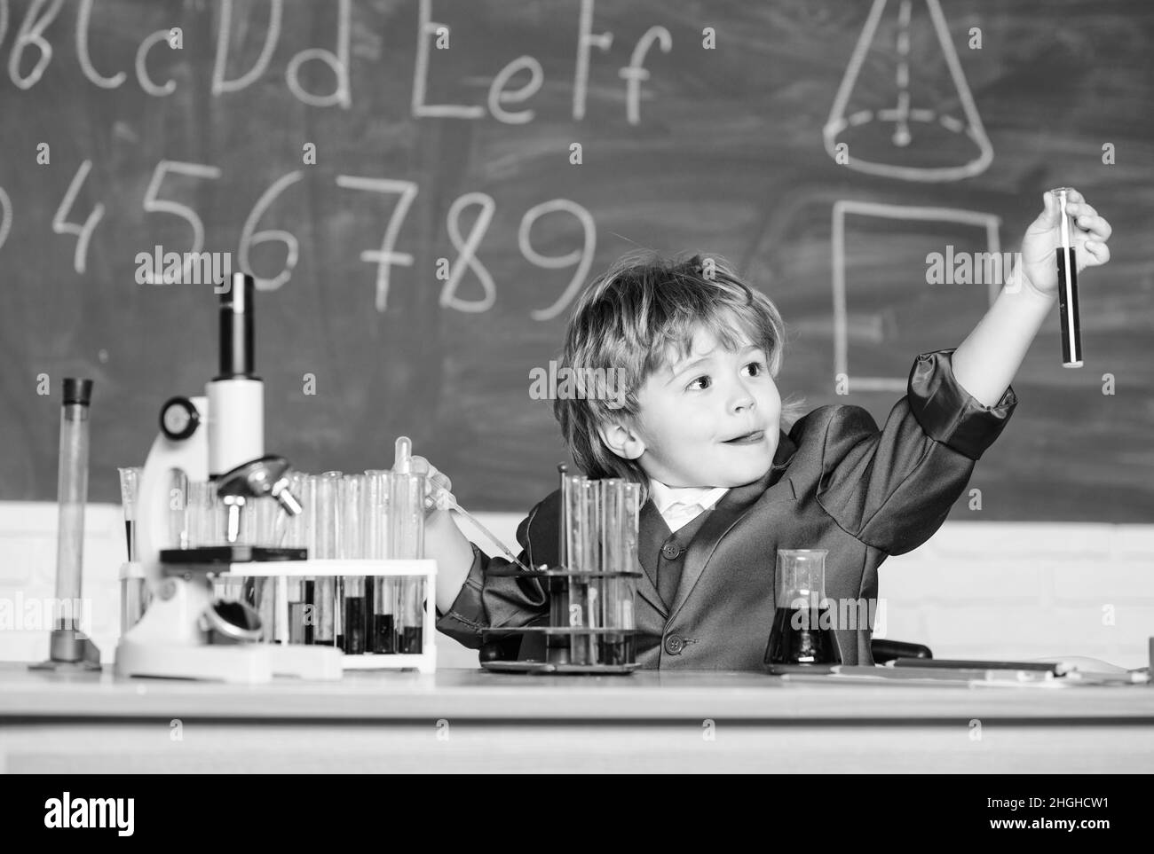 Back to school. Pupil looking through microscope . student do science ...