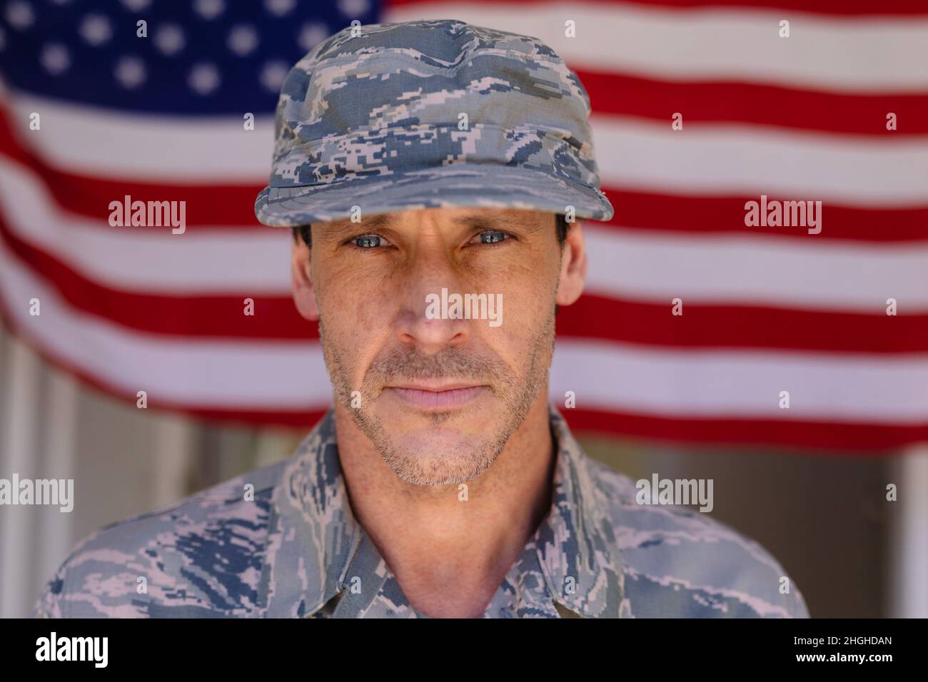 Portrait of caucasian military soldier wearing cap and camouflage ...