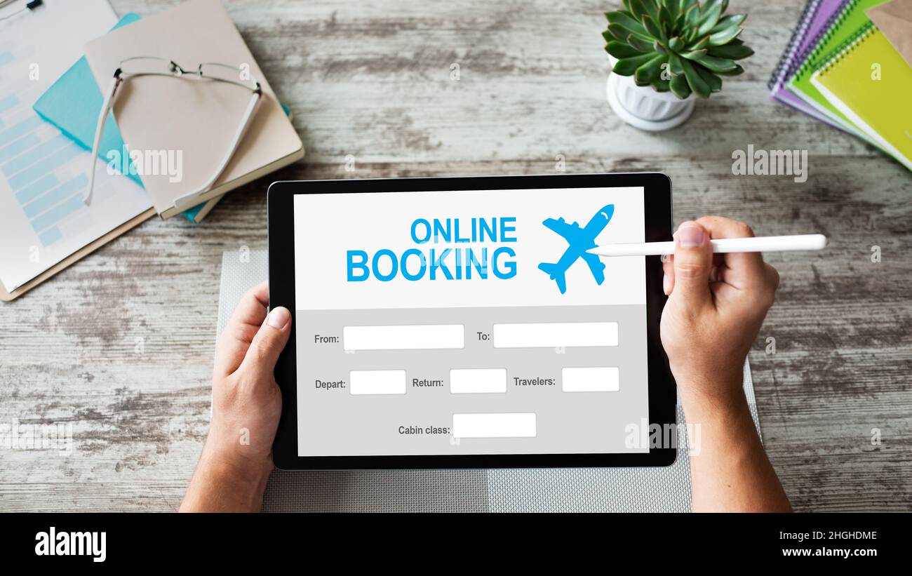 Online flight booking service form on device screen Stock Photo - Alamy