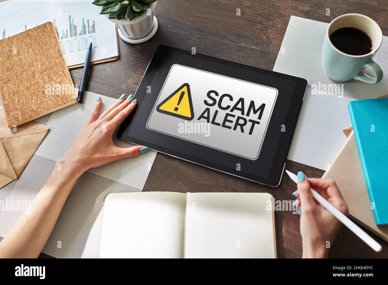 Scam alert detecting warning. Notification on device screen Stock Photo ...