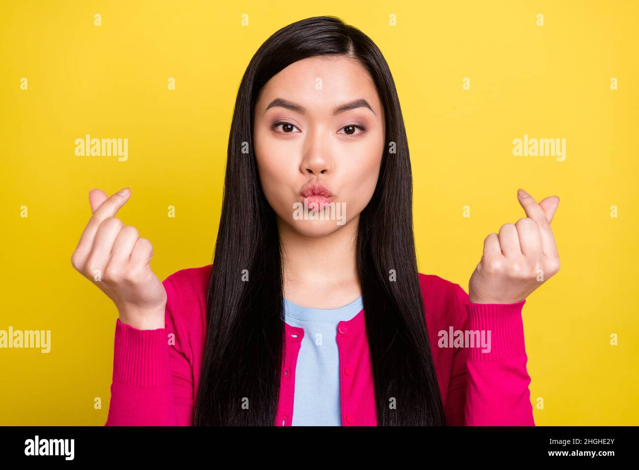 Photo of cheerful happy positive young woman send air kiss crossed ...