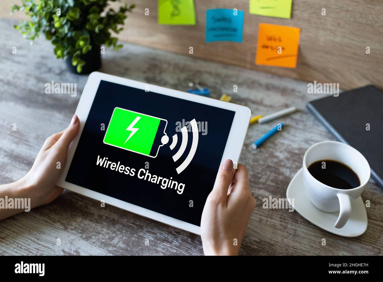 Wireless charging icons and progress bar on device screen Stock Photo ...