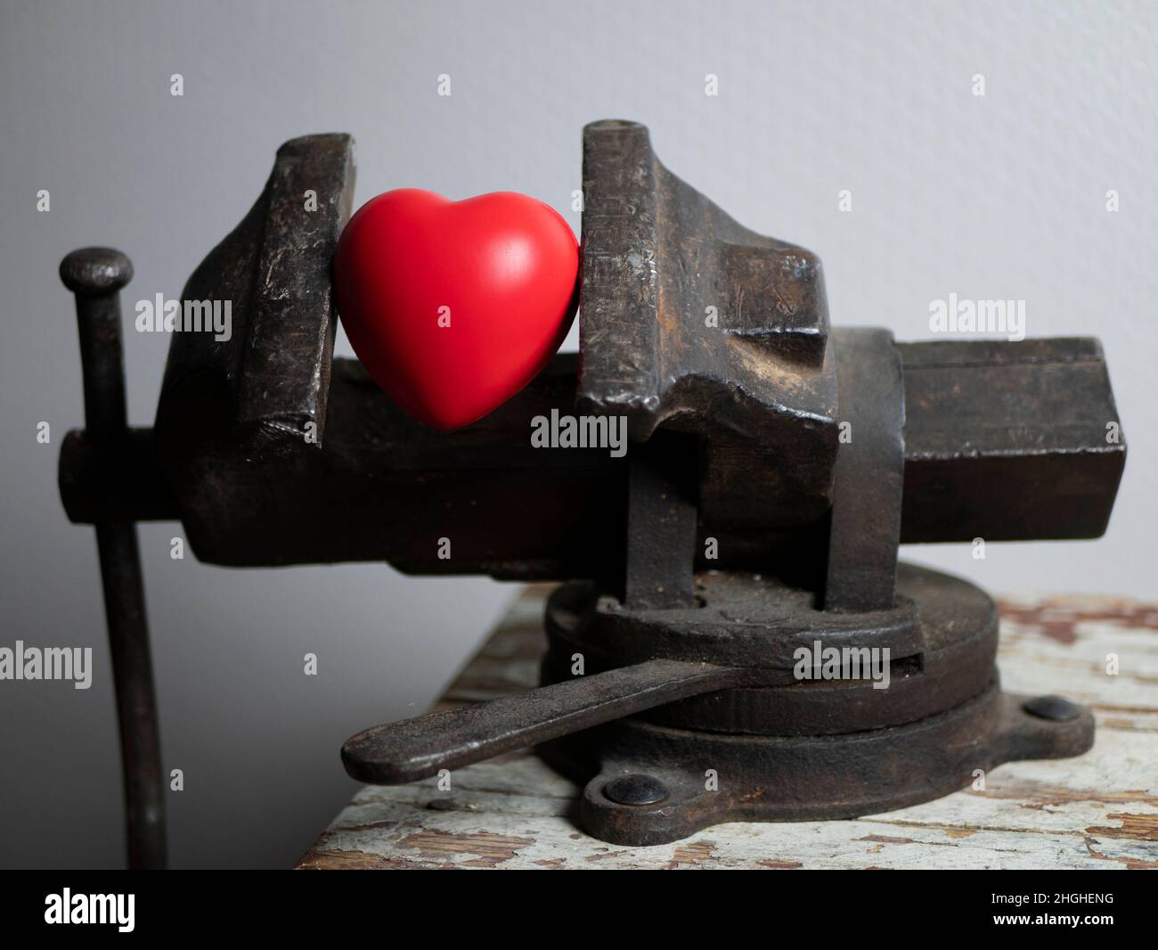 Heart in a vice. Concept of captivity, stress, overpressure Stock Photo ...