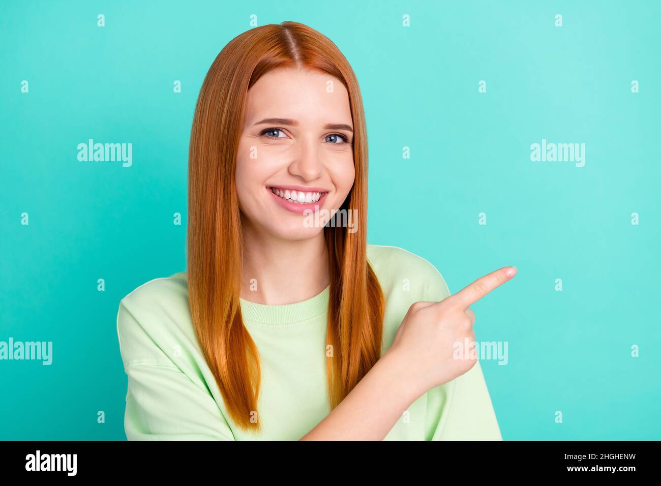 Photo of funky millennial ginger hairdo lady point empty space wear ...