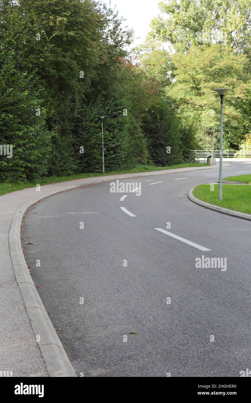 Long asphalt road in park hi-res stock photography and images - Alamy