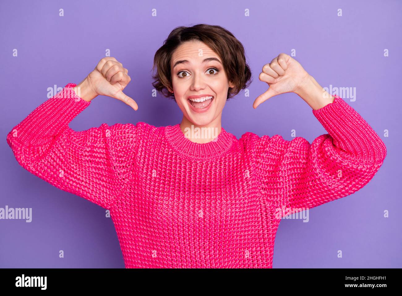 Portrait of impressed girl show not approve sign wear pink sweater ...