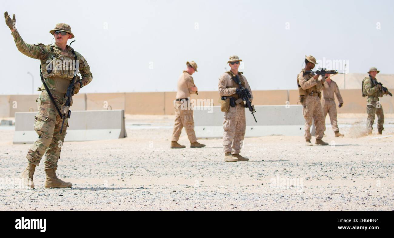 A U.S. Air Force security forces member calls commands during Marine ...