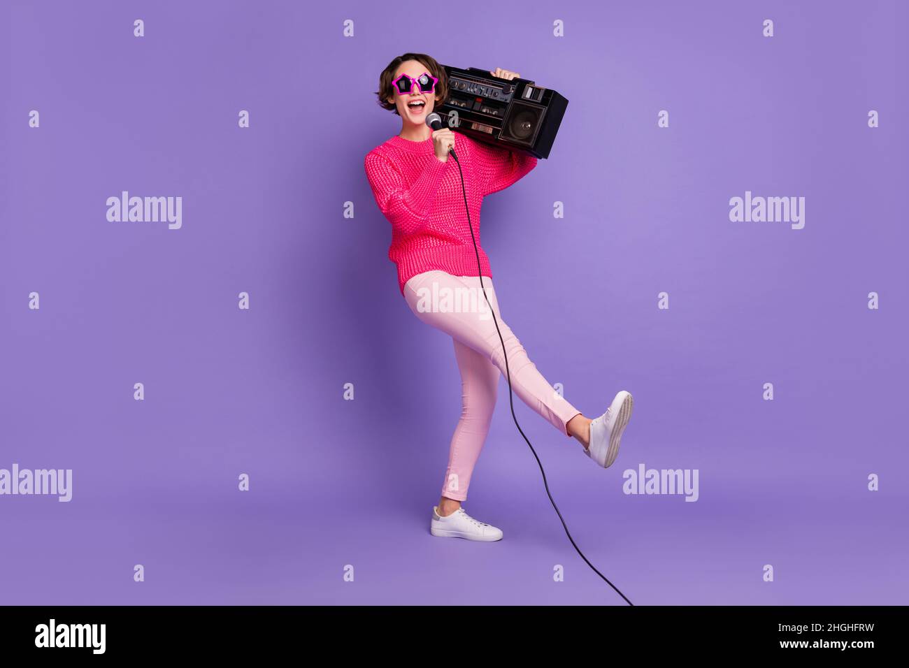 Full size photo of young excited girl happy have fun sing song ...