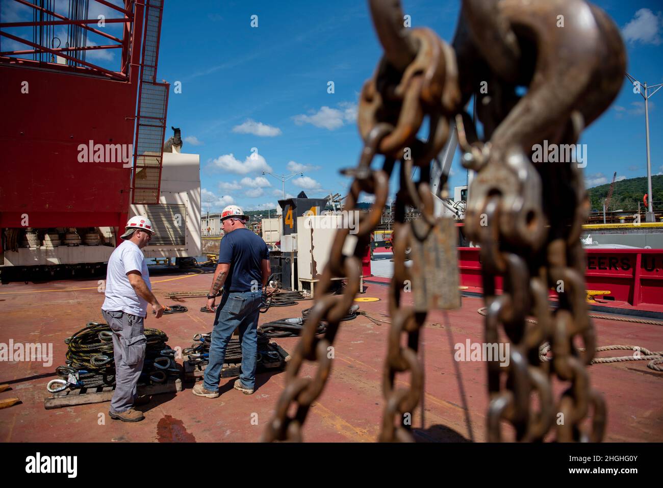 Joe Stipkovitz, a derrick boat master, and Martin Litzinger, a lock and dam maintenance and ...