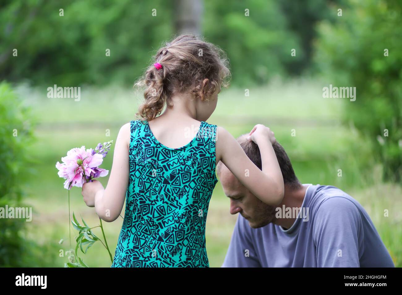 Patting child on head hi-res stock photography and images - Alamy
