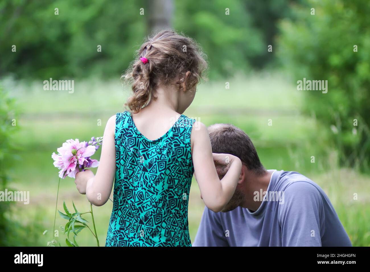 Patting child on head hi-res stock photography and images - Alamy