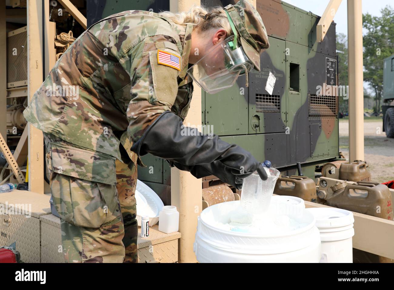 U. S. Army Sgt. Alicia Plein, a water treatment specialist assigned to ...