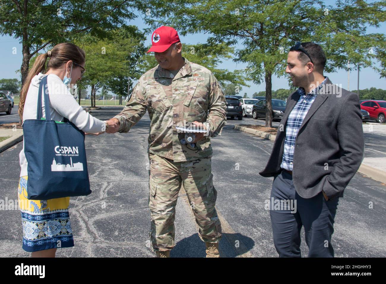 Col. Michael A. Hrynciw, 2ooth RED HORSE Commander, hands coin to ...