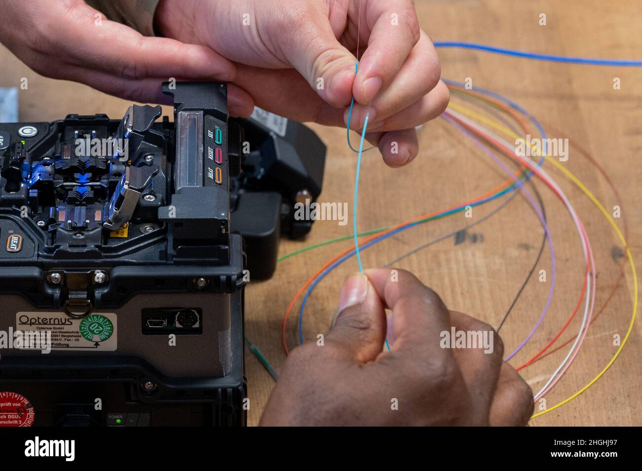 A team of technicians from the 1st Communications Maintenance Squadron demonstrate fiber cable ...