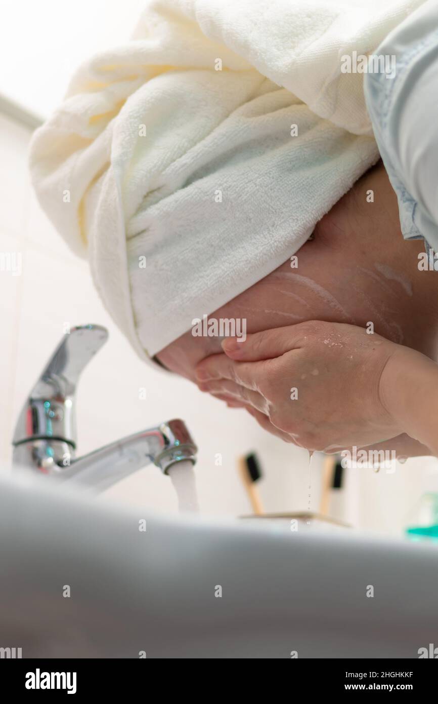 Woman wash face basin hi-res stock photography and images - Alamy