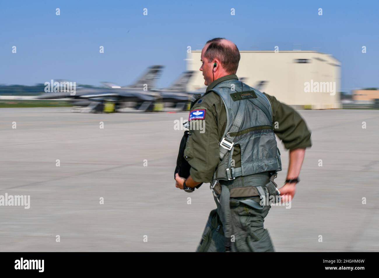 Lt. Col. Jon Friedman, pilot with the 114th Fighter Wing, sprints to ...
