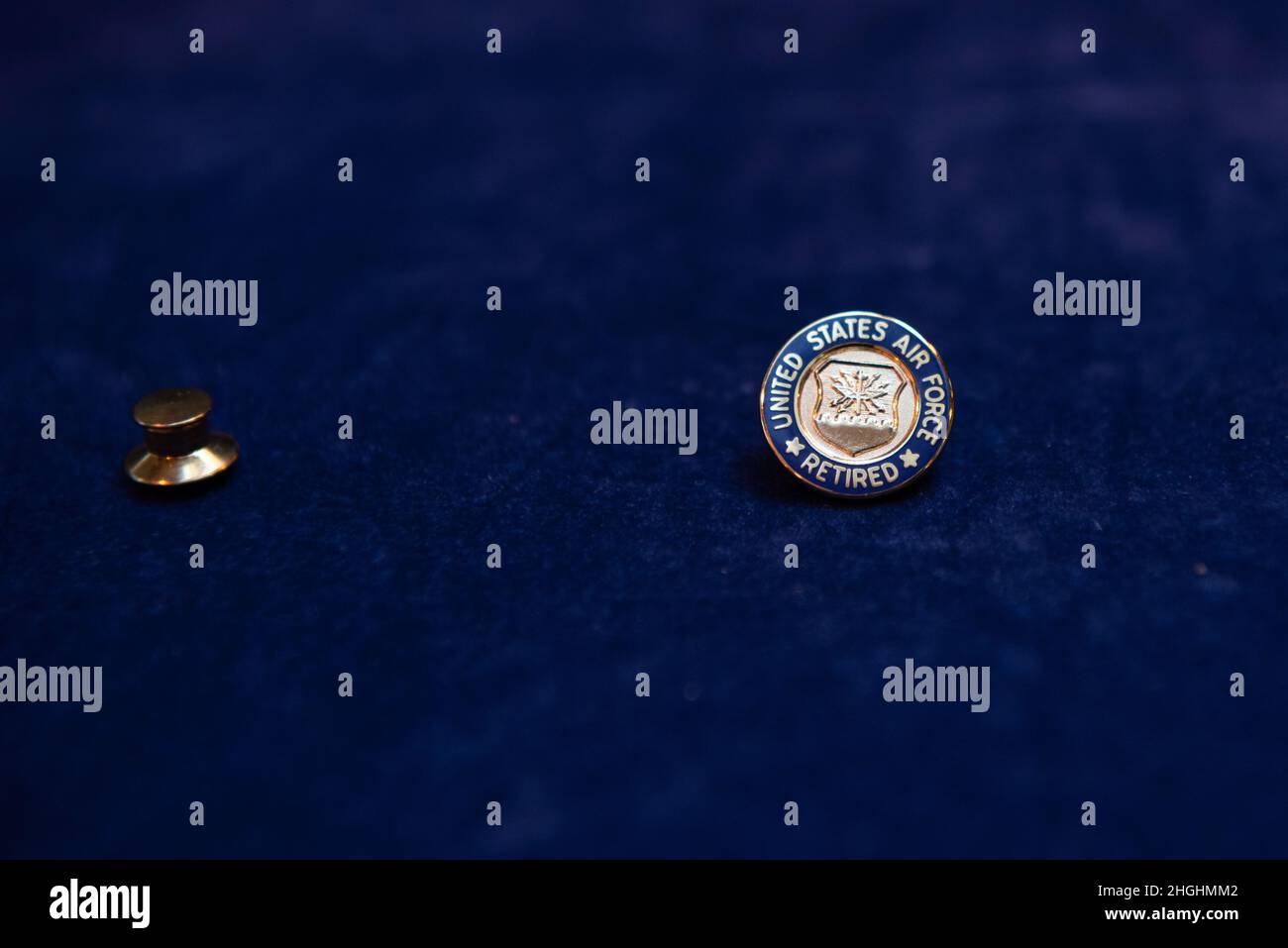 A U.S. Air Force retirement lapel pin is presented to Air Force ...