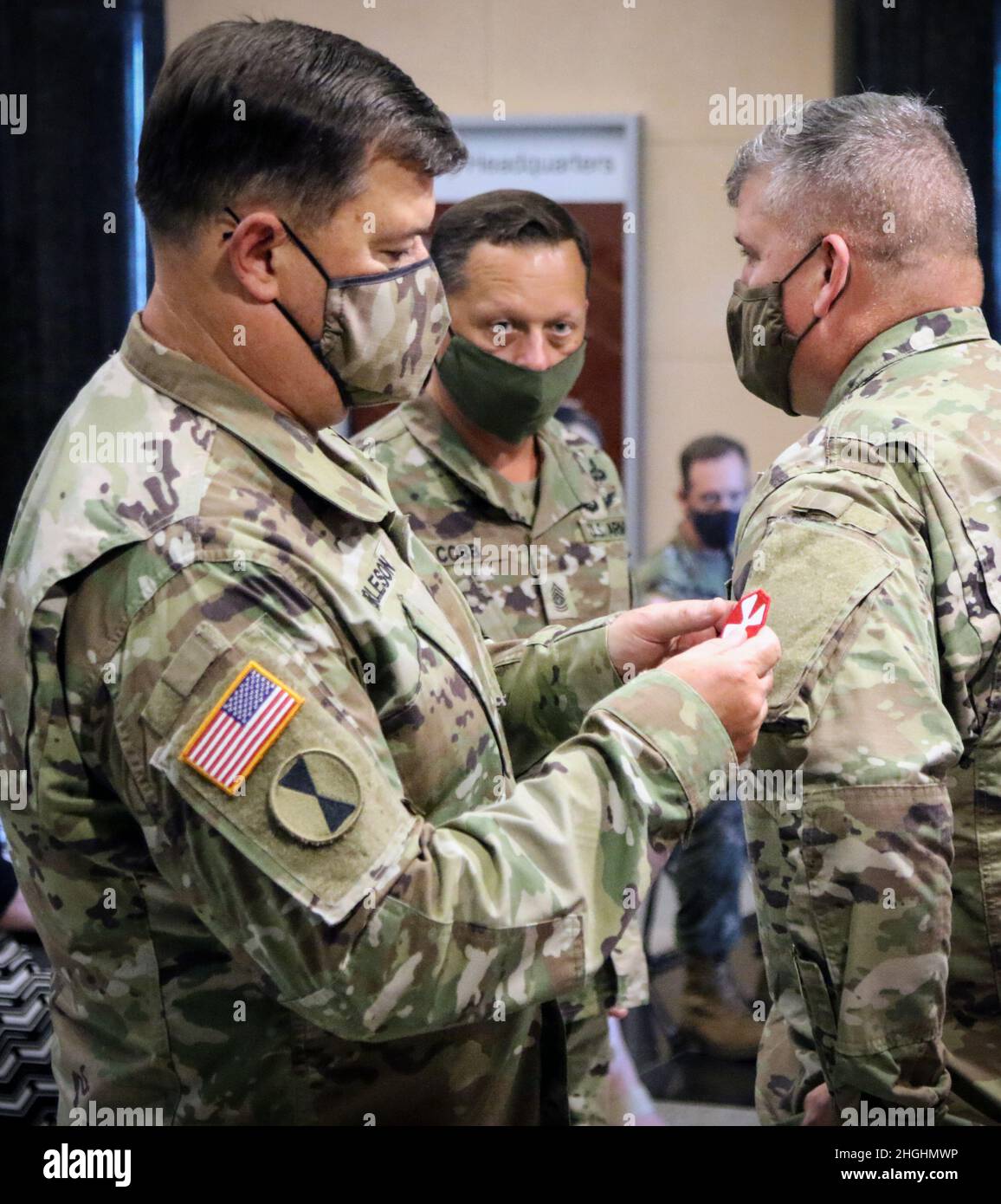 Lt. Gen. Bill Burleson (left), Eighth Army commanding general, places ...
