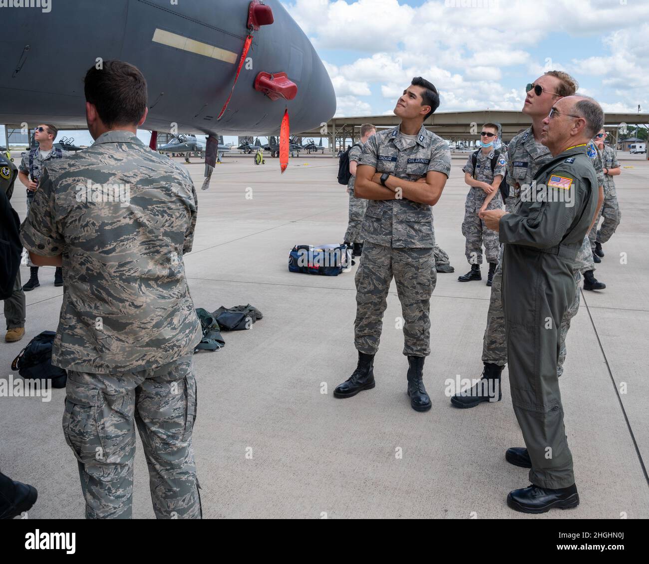 Maj. Gen. Mark Smith talks with Civil Air Patrol students while looking ...