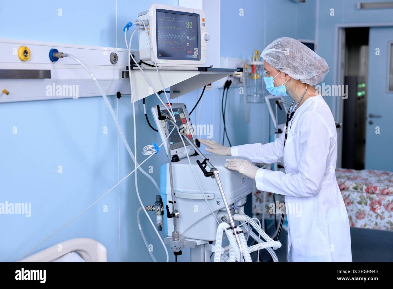 Confident Caucasian Female Doctor Setting Up Medical Equipment Device ...