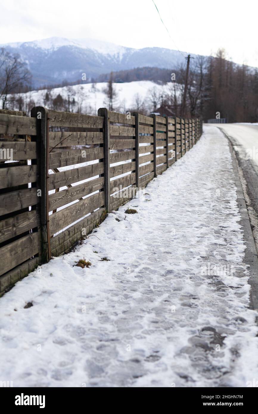 slippery sidewalk in winter covered with slush full of footprints Stock ...