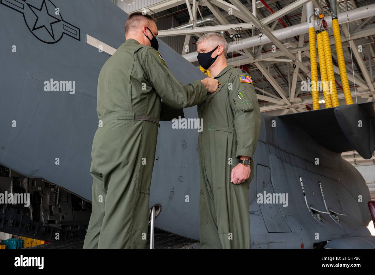 Col. Bryan Bailey, 911th Operations Group commander, affixes the ...