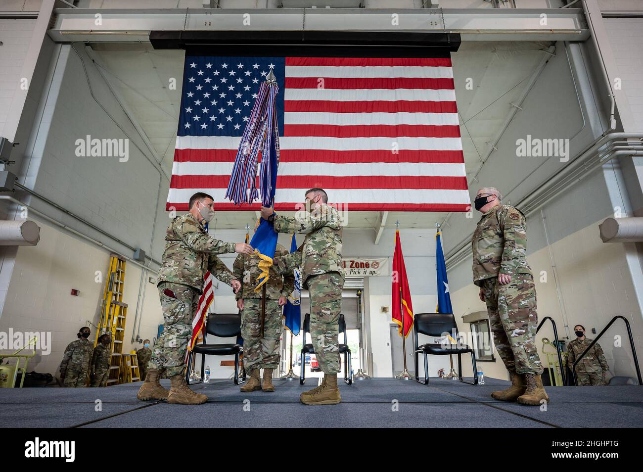 Col. Bruce Bancroft (center) accepts the 123rd Airlift Wing guidon from ...