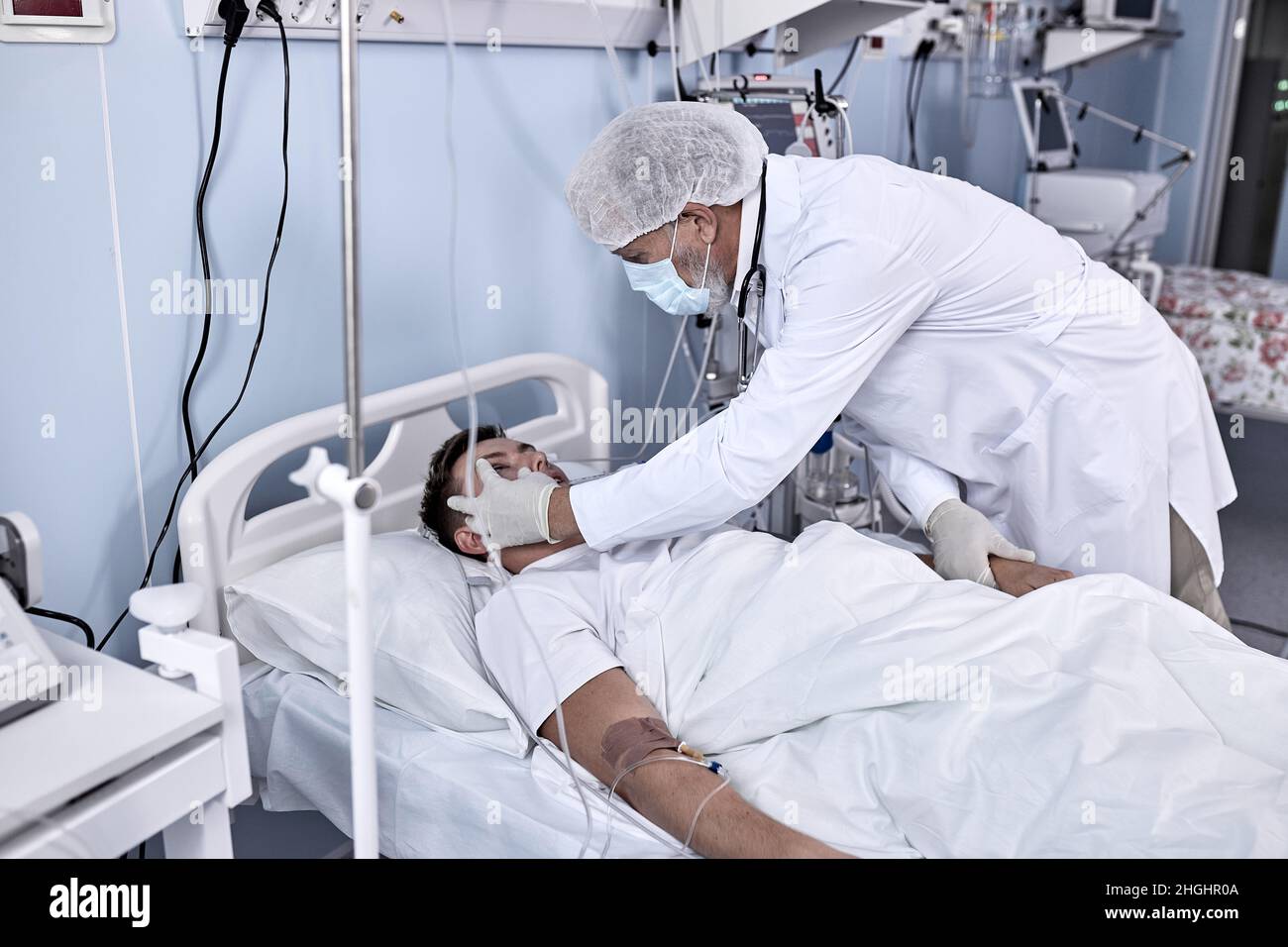 injured male lying in bed hospital room in bad health condition after ...
