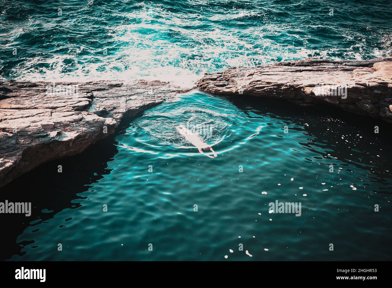 woman swimming in sea cove with turquoise water Stock Photo - Alamy