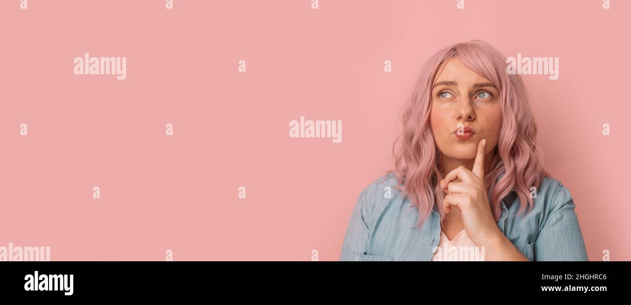 Pensive dreamy young woman thinking an new idea looking away isolated ...