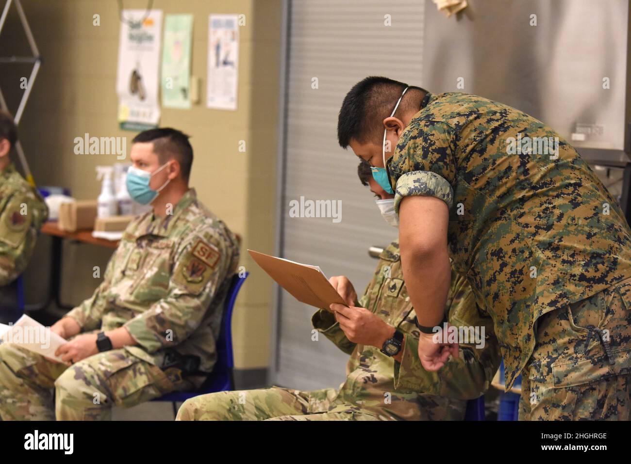 U.S. Navy HM2 Sean Hwang, 4th Dental Battalion, review dental forms ...
