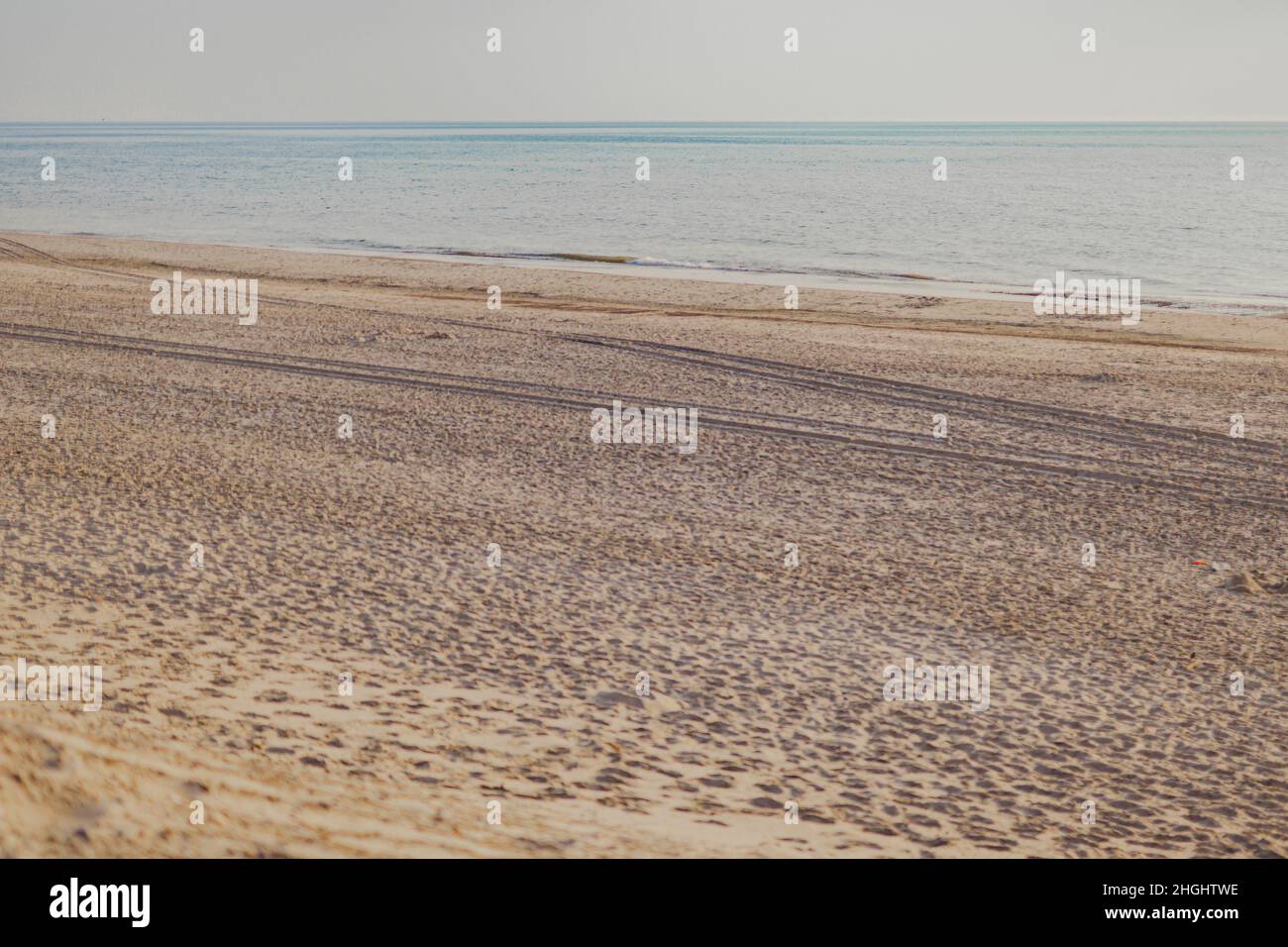 empty wide beach against blue ocean Stock Photo - Alamy