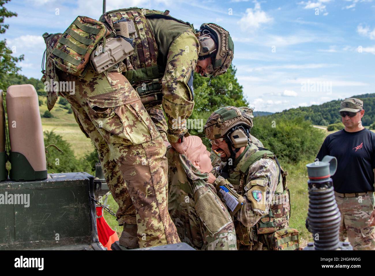 Italian soldiers finish the mannequin-casualty-drag portion of the ...