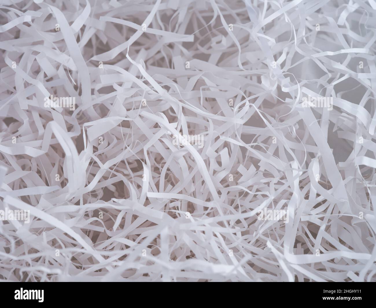 A white shredded wrapping paper background. Full frame Stock Photo - Alamy