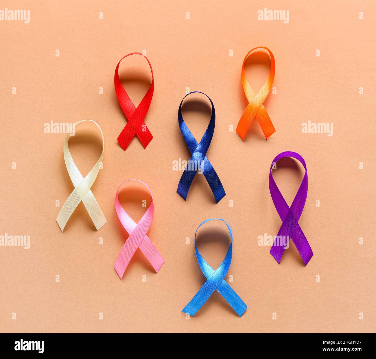 Different awareness ribbons on beige background. World Cancer Day Stock ...