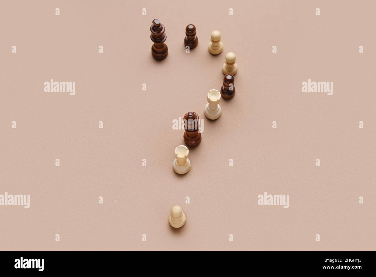 Question mark made of chess pieces on color background Stock Photo - Alamy