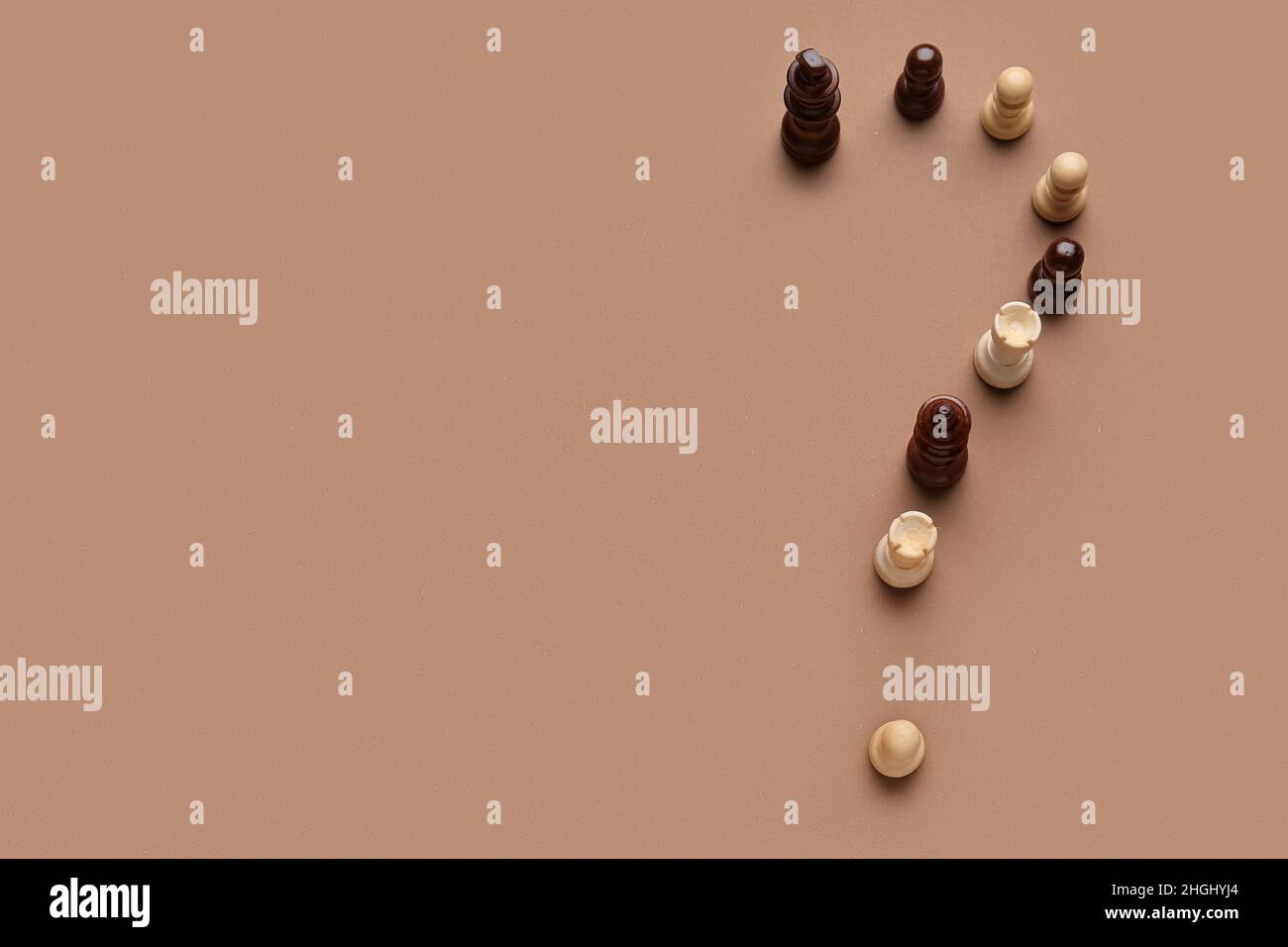 Question mark made of chess pieces on color background Stock Photo - Alamy