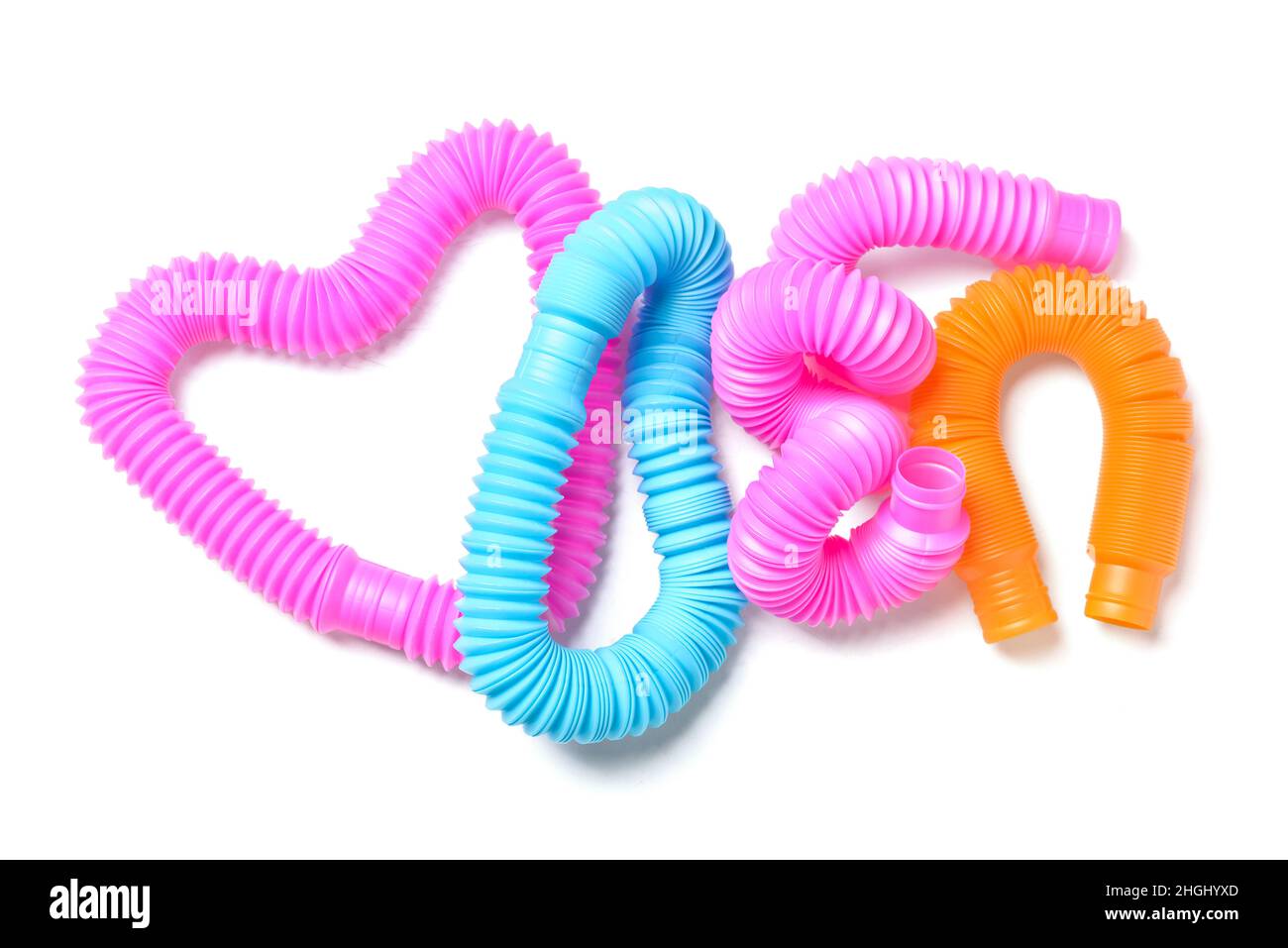 Different colorful Pop Tubes on white background Stock Photo - Alamy