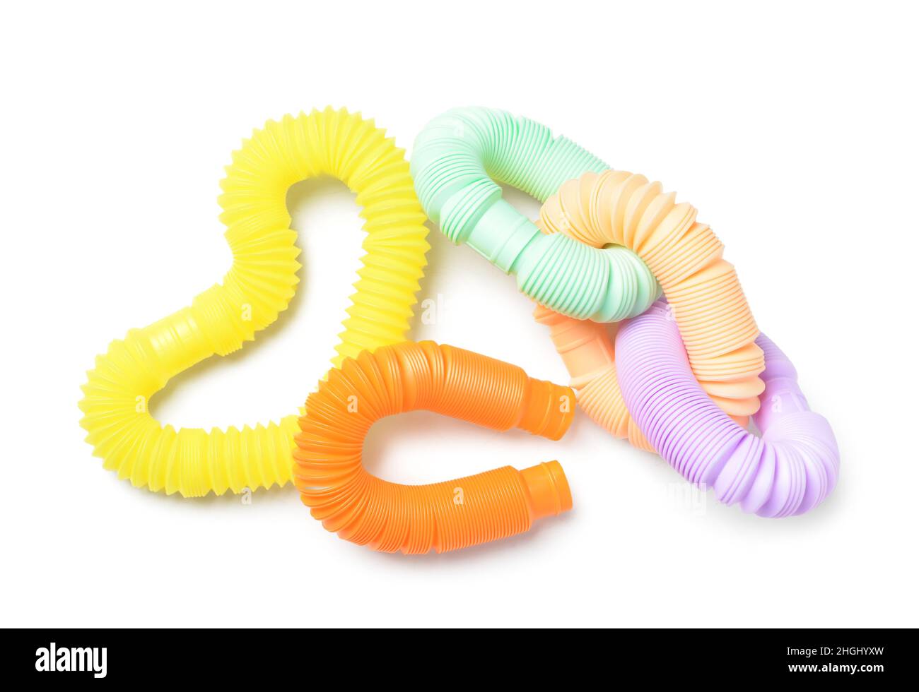 Different colorful Pop Tubes on white background Stock Photo - Alamy