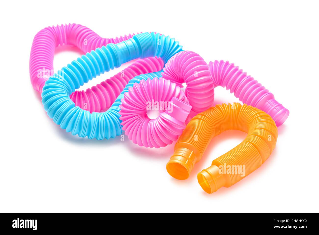 Different colorful Pop Tubes on white background Stock Photo - Alamy