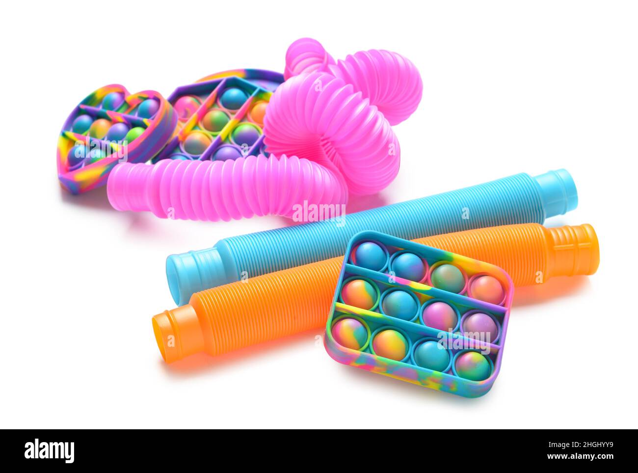 Colorful Pop Tubes and Pop it fidget toys on white background Stock ...