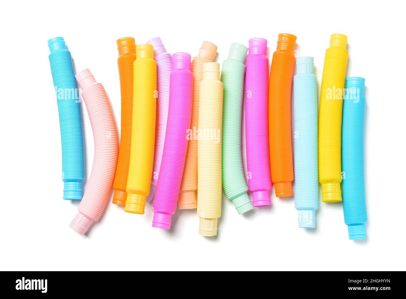 Different colorful Pop Tubes on white background Stock Photo - Alamy