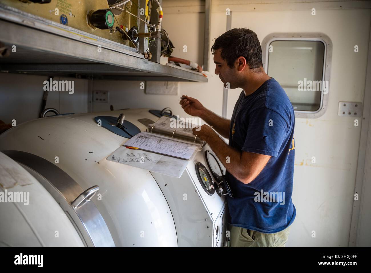 Navy Diver 2nd Class Brandon Barreto, assigned to Mobile Diving Salvage ...