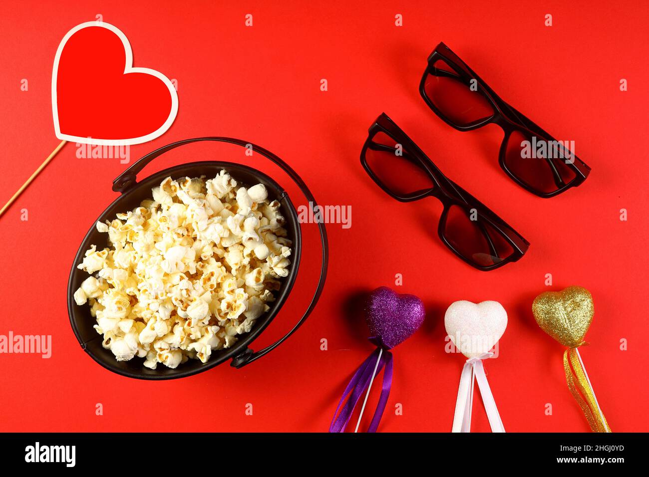 Love cinema concept of popcorn. Heart shaped white fluffy popcorn on ...