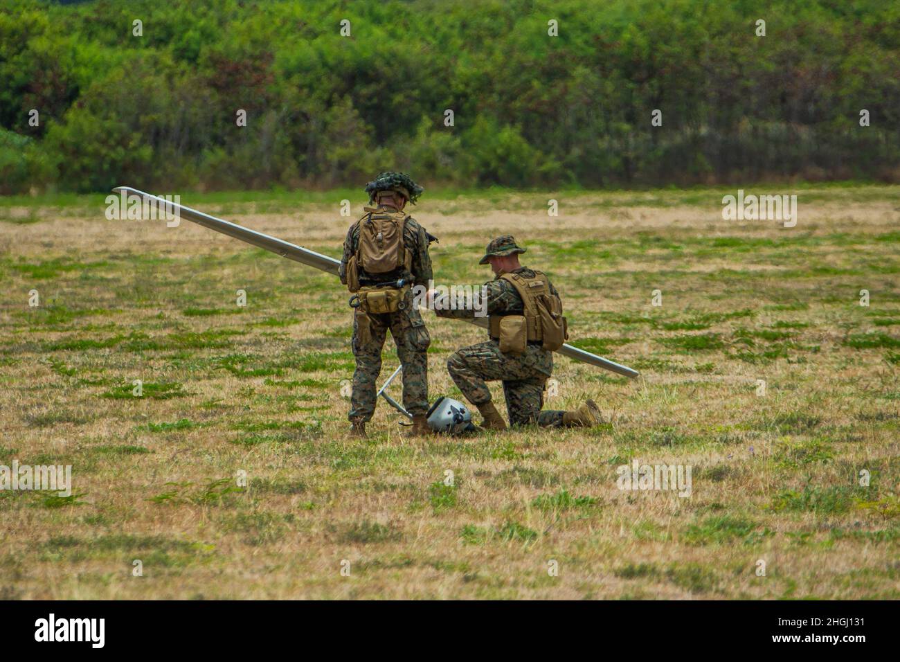 U.S. Marines with 1st Battalion, 3d Marines, 3d Marine Division recover ...