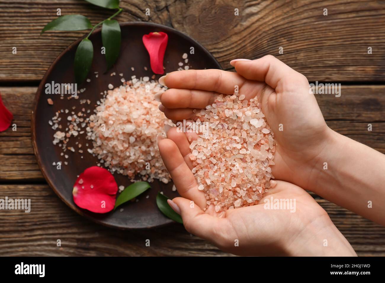 Woman pouring salt hands hi-res stock photography and images - Alamy