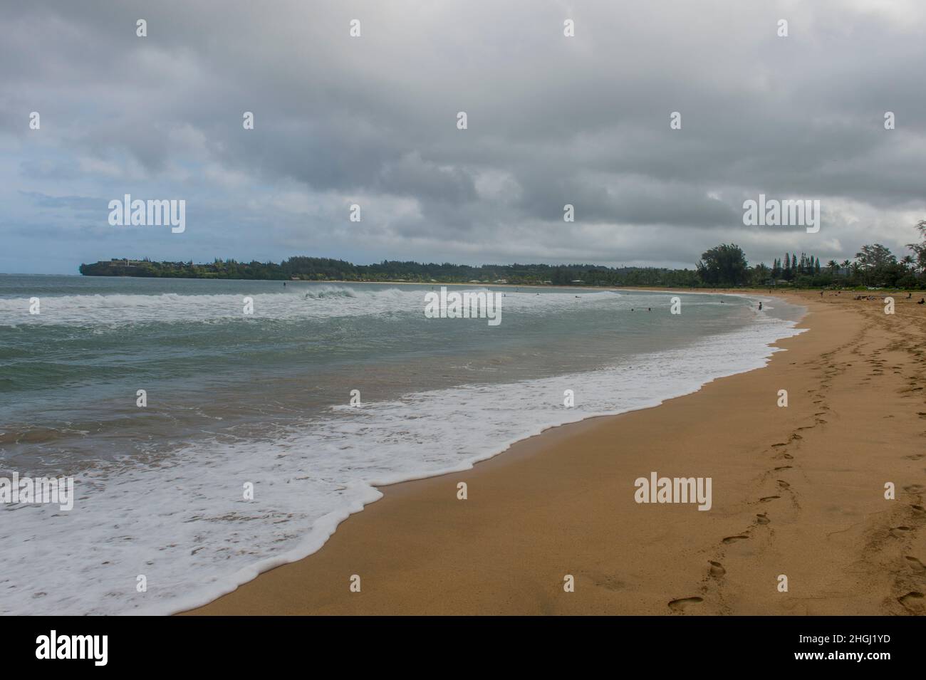 Dark rain clouds over Hanalei beach on the northern end of the Hawaiian ...