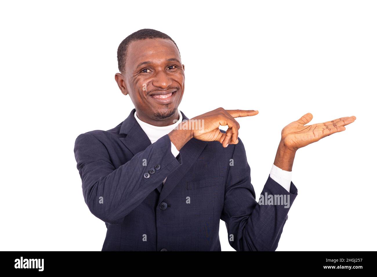 handsome adult businessman pointing finger on empty palm and smiling at ...