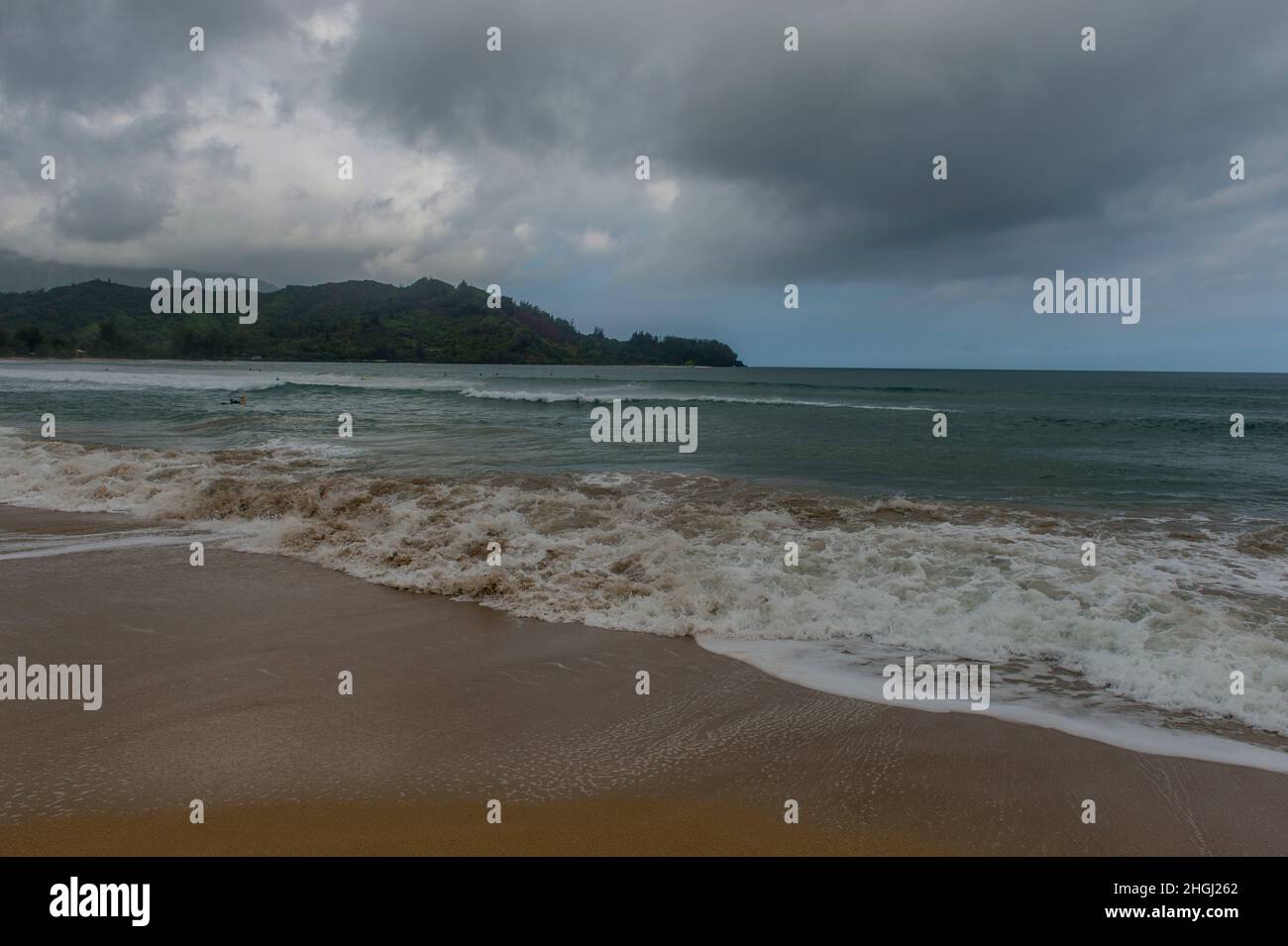 Dark rain clouds over Hanalei beach on the northern end of the Hawaiian ...